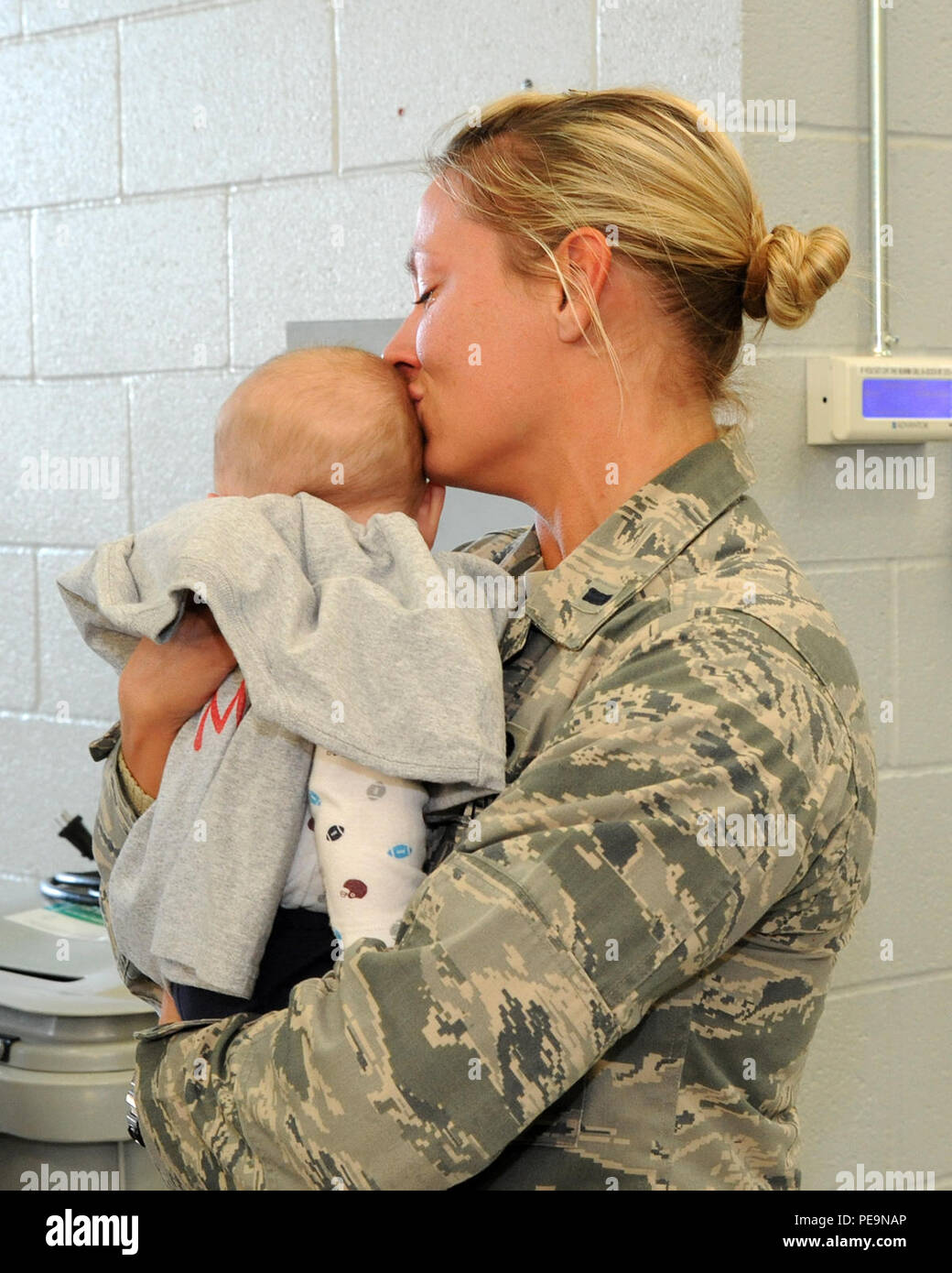 U.S. Air Force 2nd Lt. Jamie Neal is greeted by his family as the 116th ...