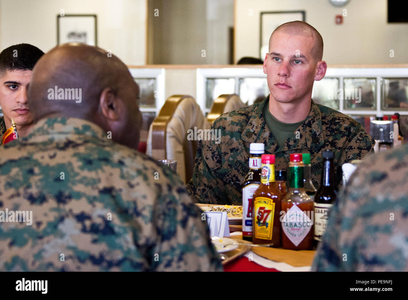 Marines listen to Sgt. Maj. of the Marine Corps Ronald L. Green, left ...