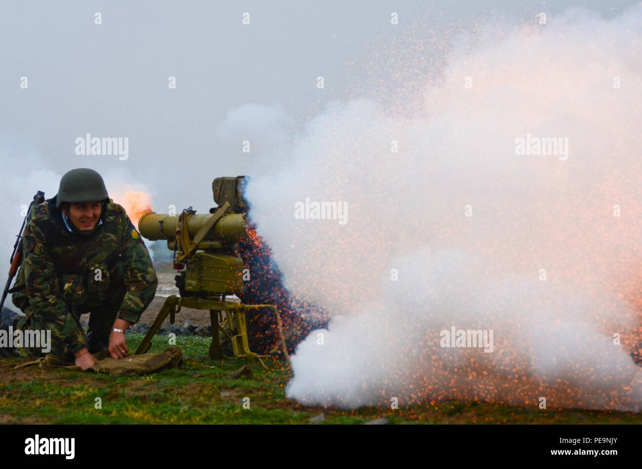 A Bulgarian soldier of 1-61st Mechanized Battalion fires a smoke cap ...