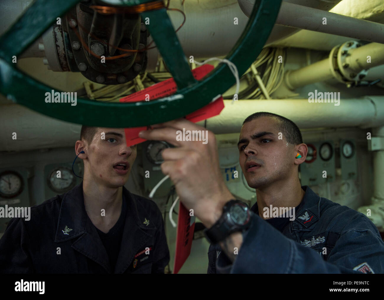 PACIFIC OCEAN (Nov. 24, 2015) Machinist’s Mate 3rd Class Cain Rabitoy ...
