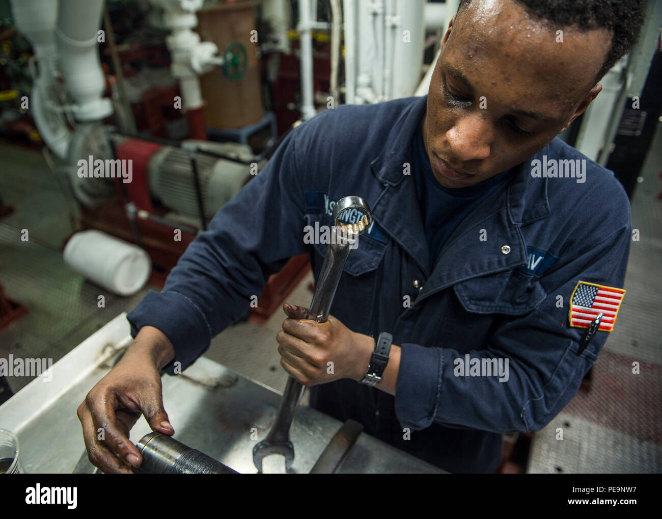 PACIFIC OCEAN (Nov. 24, 2015) Machinist’s Mate Fireman Dion Washington ...