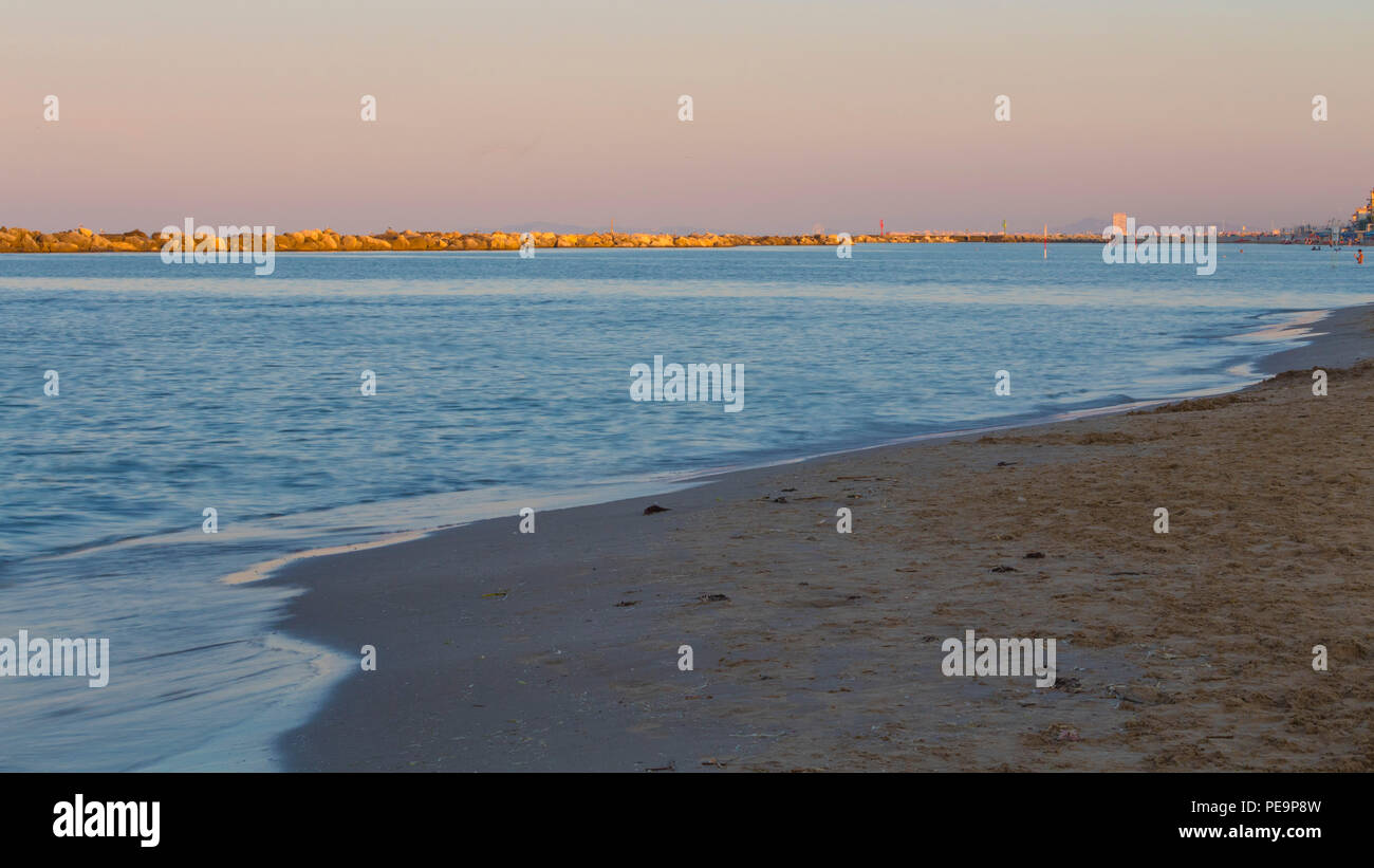 Beautiful sunset reflected on italian sea waves Stock Photo - Alamy