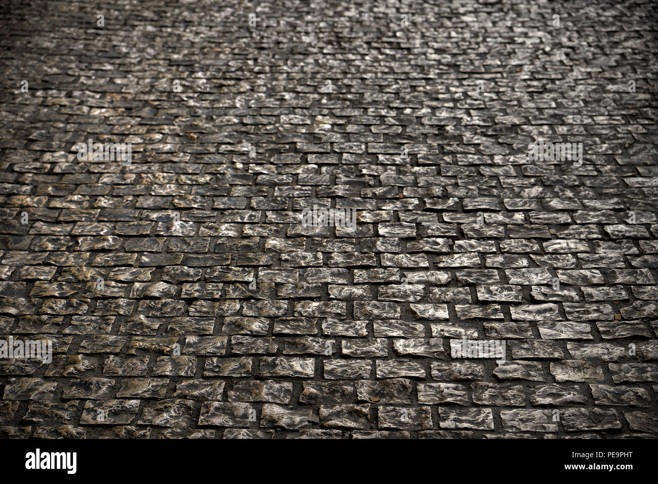 old cobble stone road surface paving background texture Stock Photo - Alamy