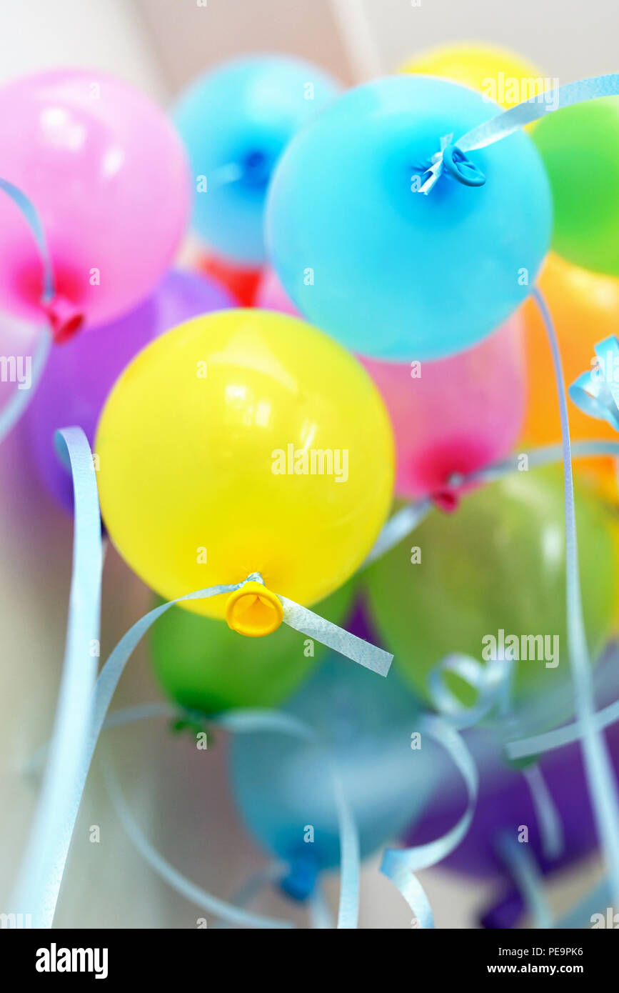 Bunch of floating colored balloons and strings at party Stock Photo - Alamy