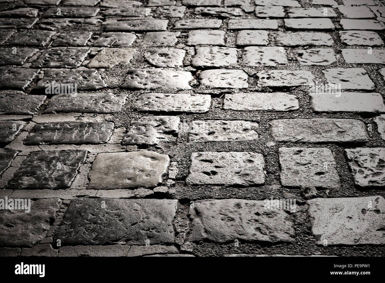old cobble stone road surface paving dark night background texture ...