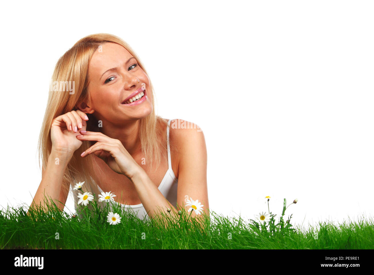 Beautiful Young Blonde Woman Lying On Grass With Chamomile Flowers