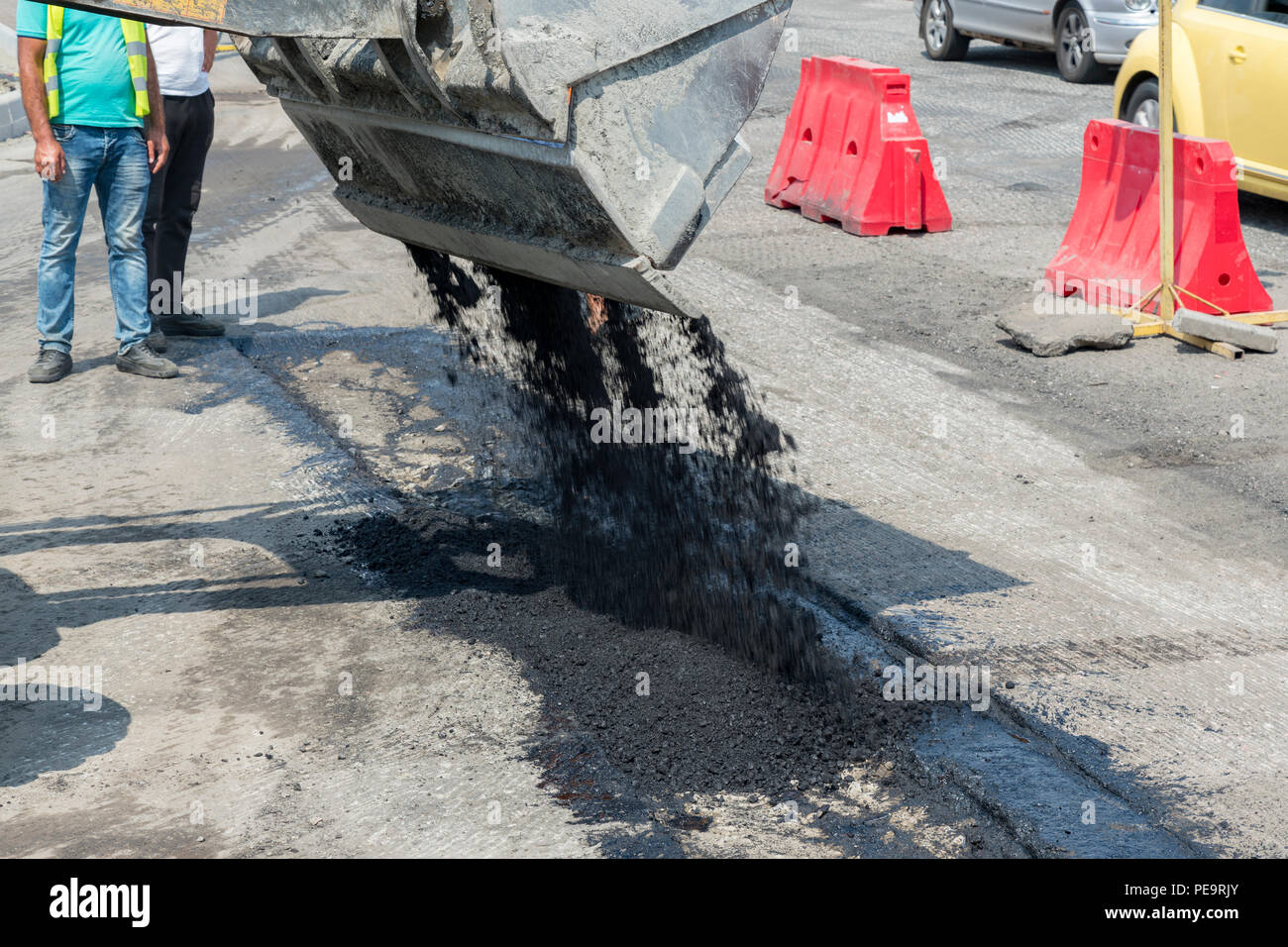 The process of asphalting roads. Machinery for asphalting roads Stock ...