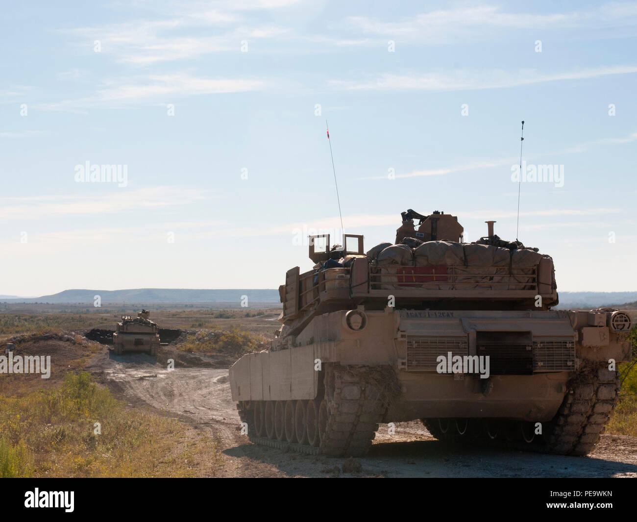 One M1A2 Abrams tank crew with the 1st Battalion, 12th Cavalry Regiment ...