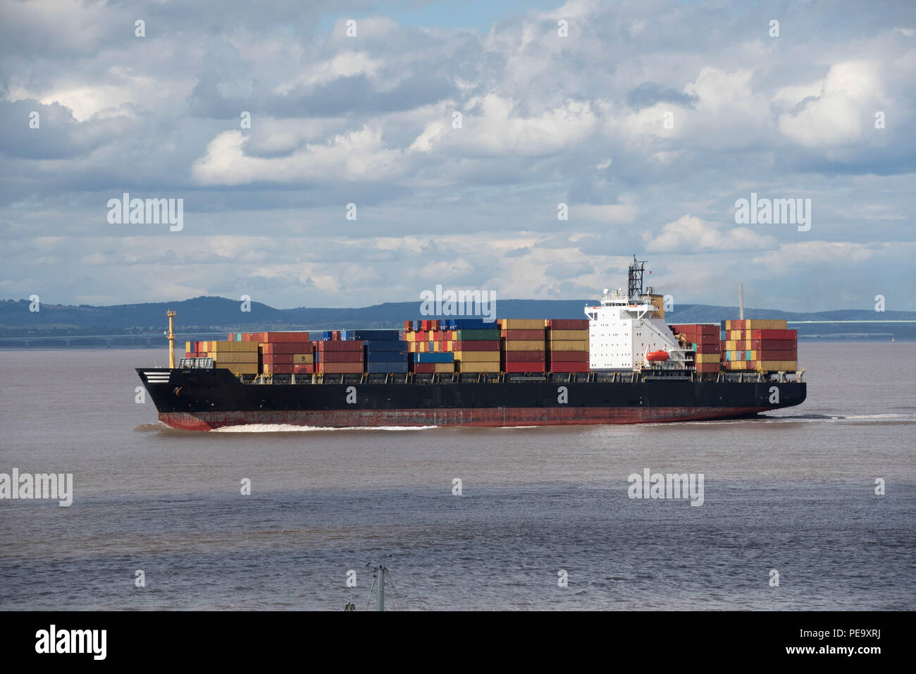 A fully loaded container ship at sea trading around the world Stock ...