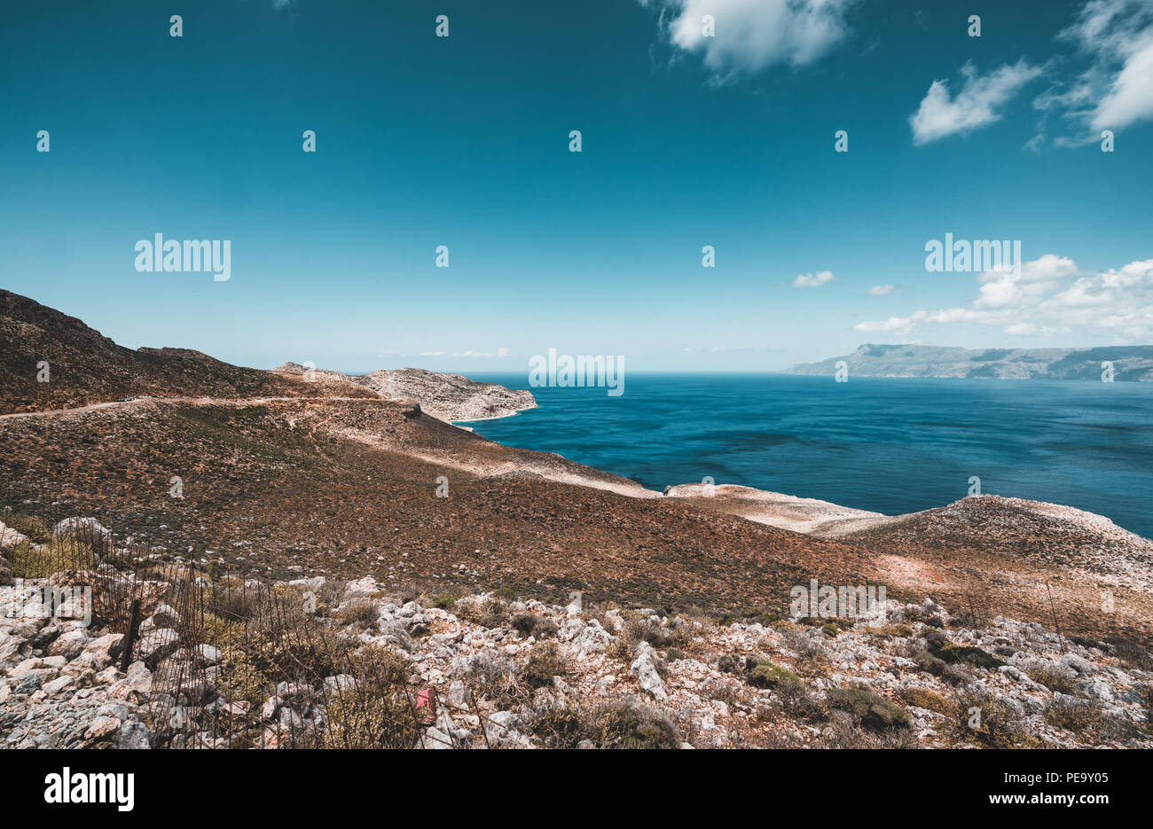 Panoramic view of rocks and beach with sky and clouds in Crete, Greece ...