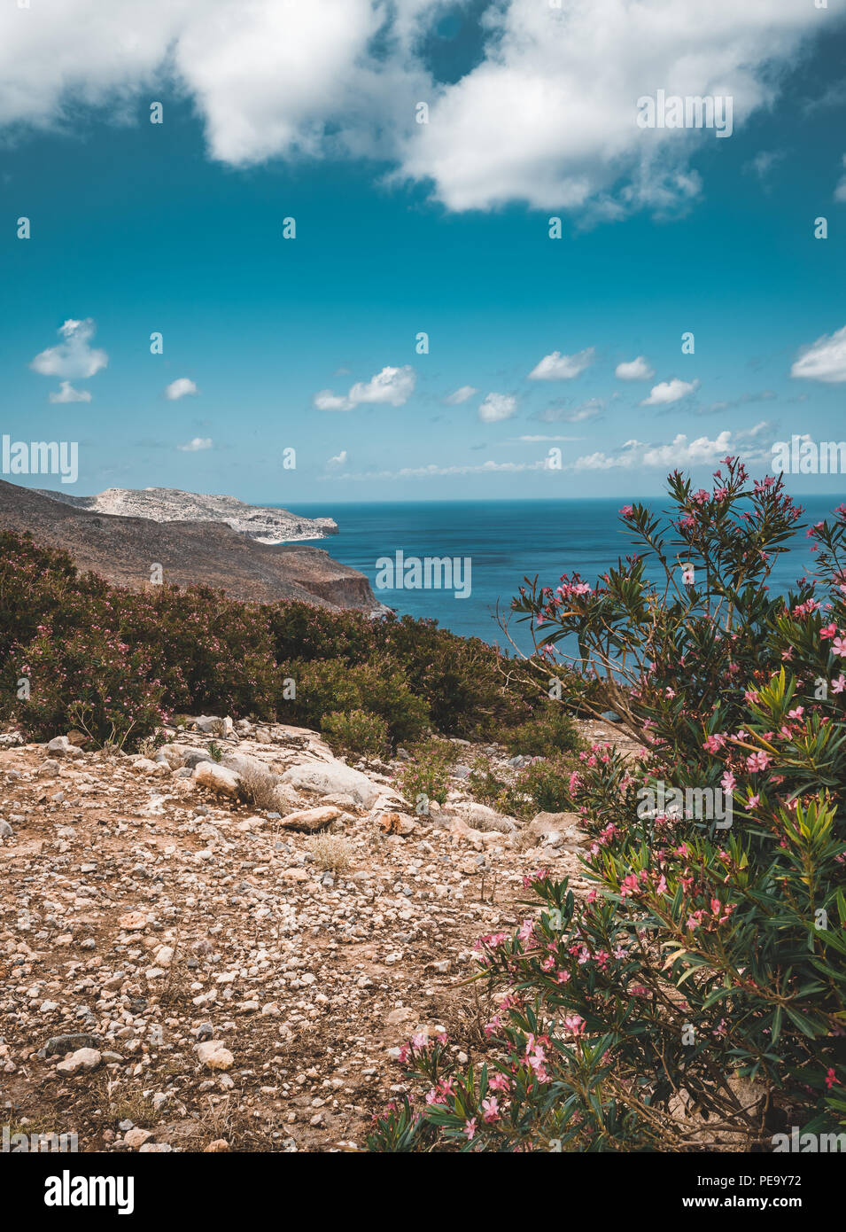 Panoramic view of rocks and beach with sky and clouds in Crete, Greece ...