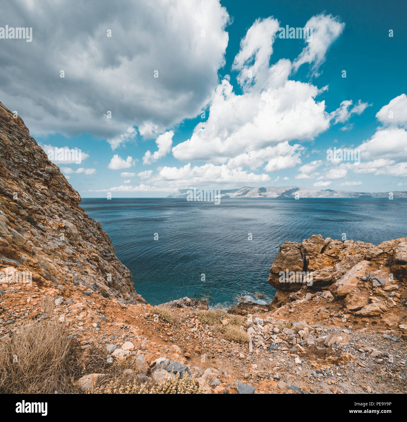 Panoramic view of rocks and beach with sky and clouds in Crete, Greece ...