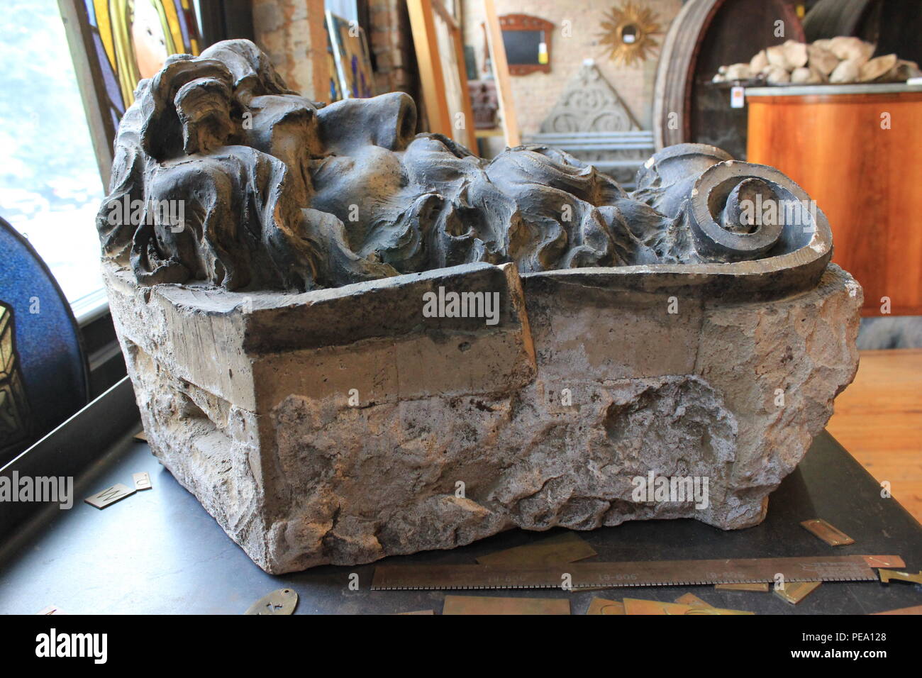Stone sculpture of man with beard on a slab of concrete at ...