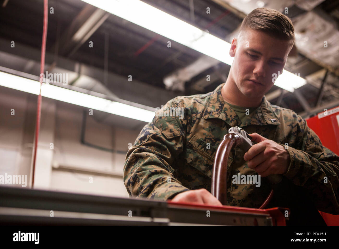 U.S. Marine Corps Lance Cpl. Raymond D. Falter, an airframe mechanic ...