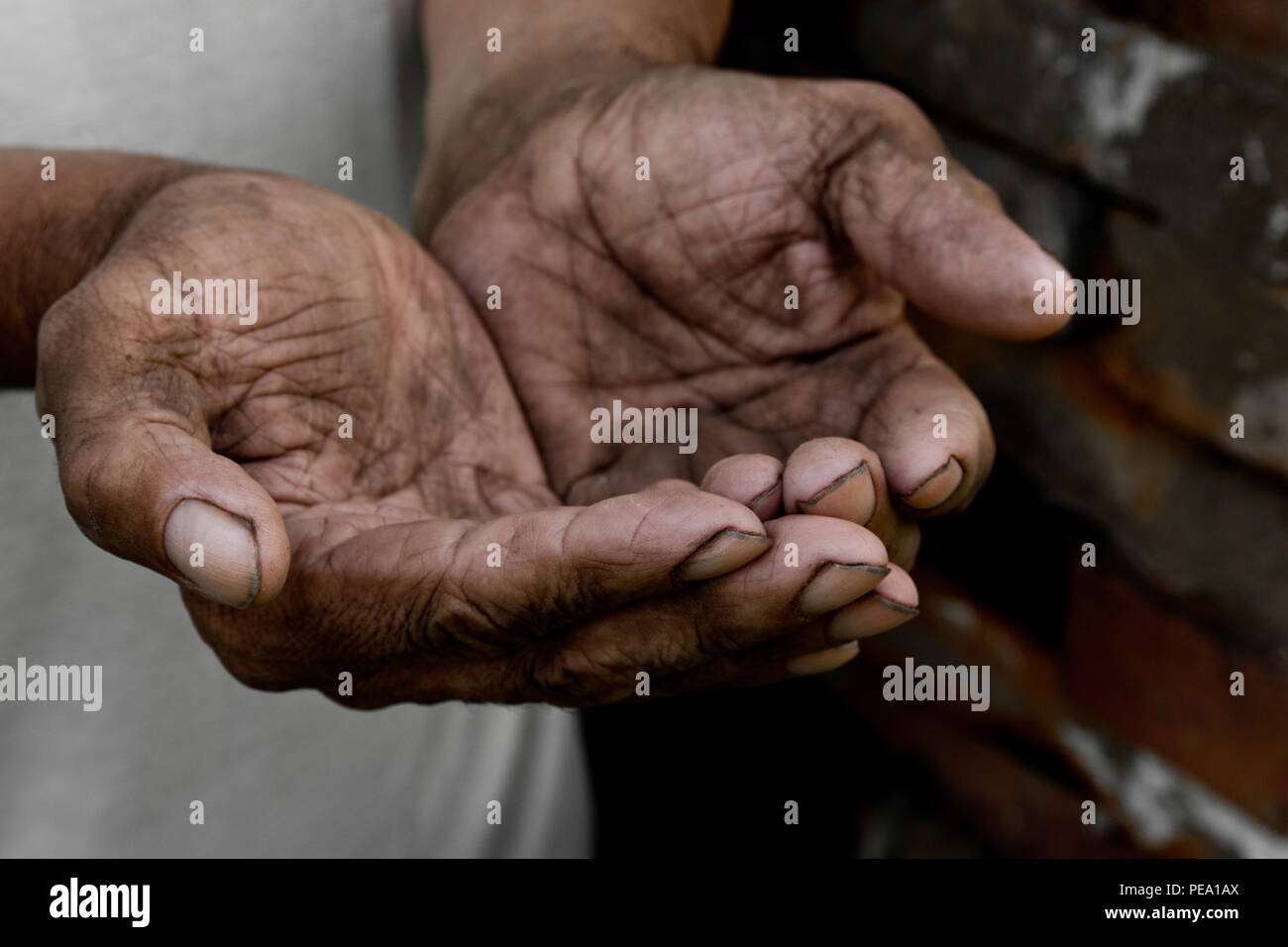 The poor old man's hands beg you for help. The concept of hunger or ...