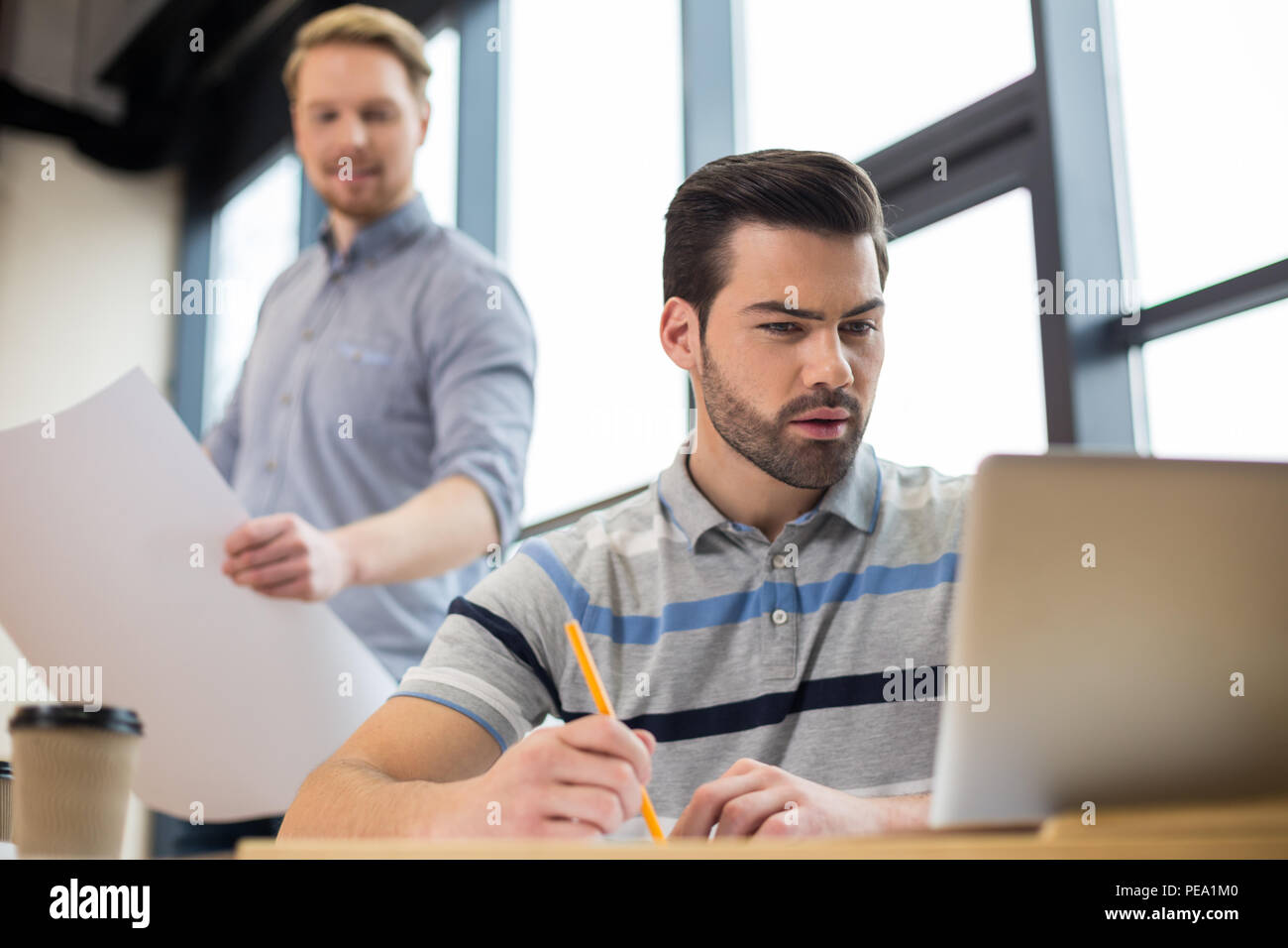 Nice intelligent man holding hi-res stock photography and images - Alamy