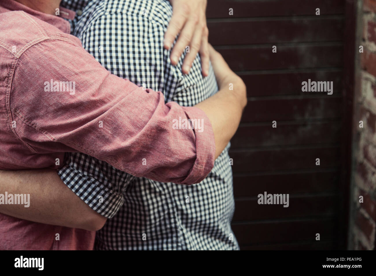 Gay men hug hi-res stock photography and images - Alamy