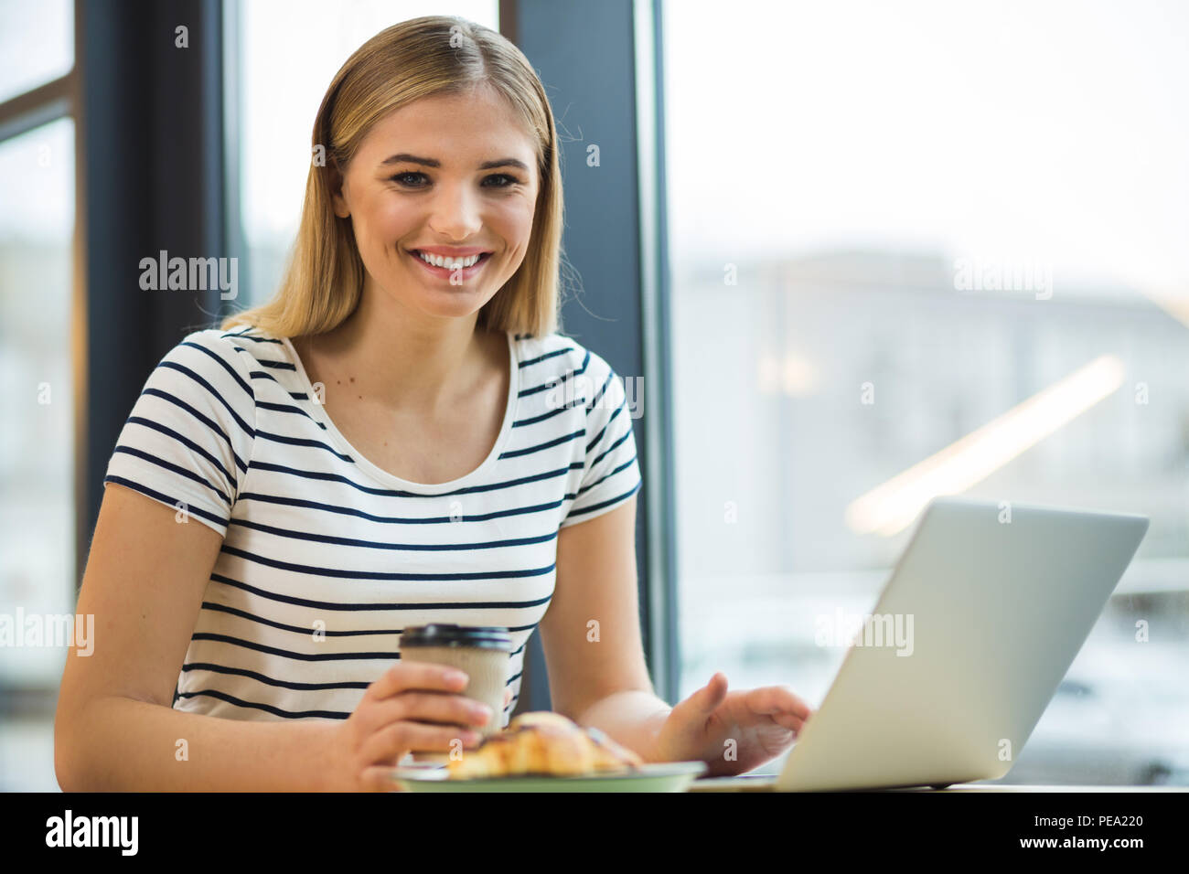 Delicious food. Positive happy nice woman smiling and looking at you ...