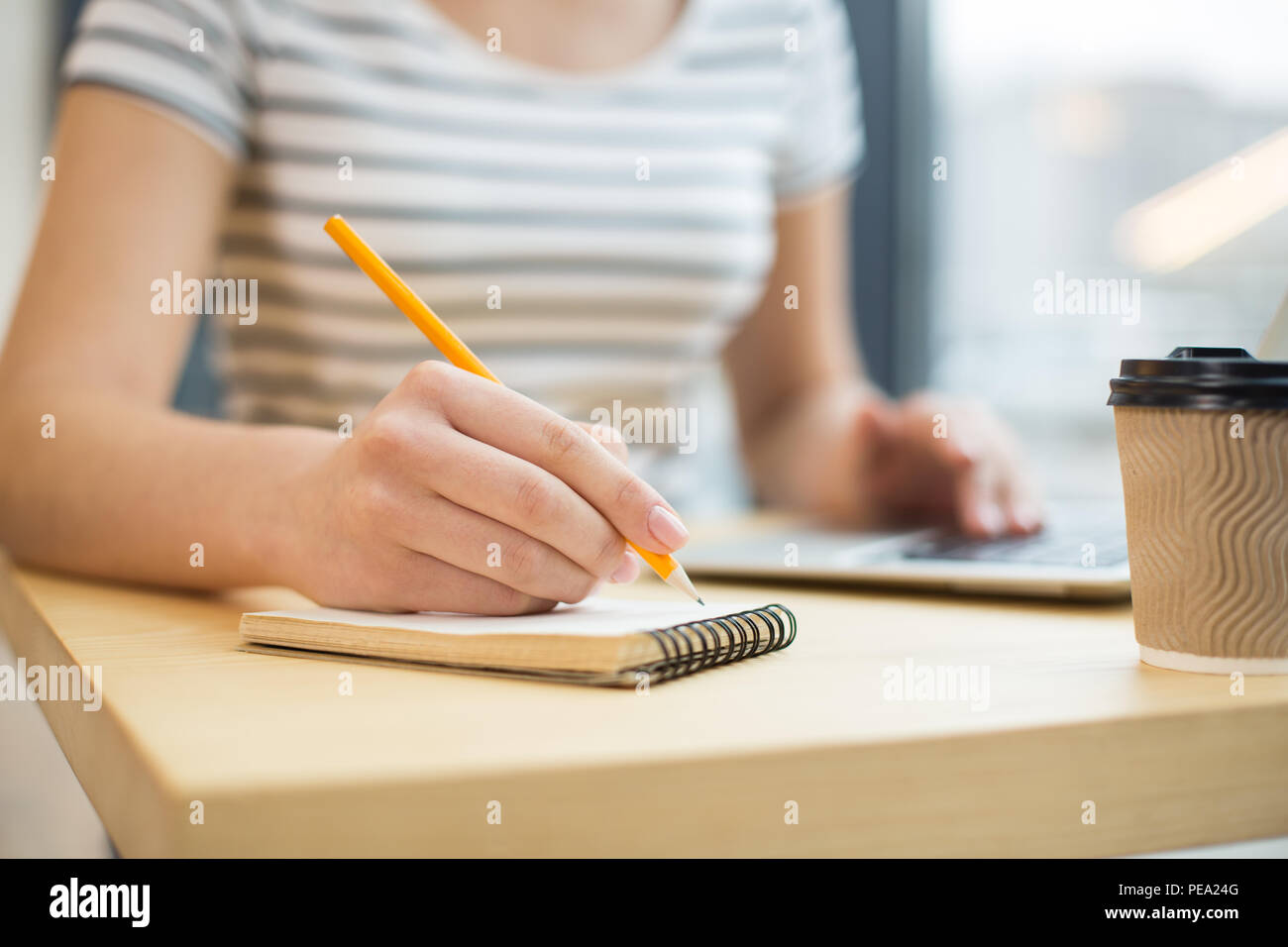 My notes. Selective focus of a pencil being used while writing notes in ...