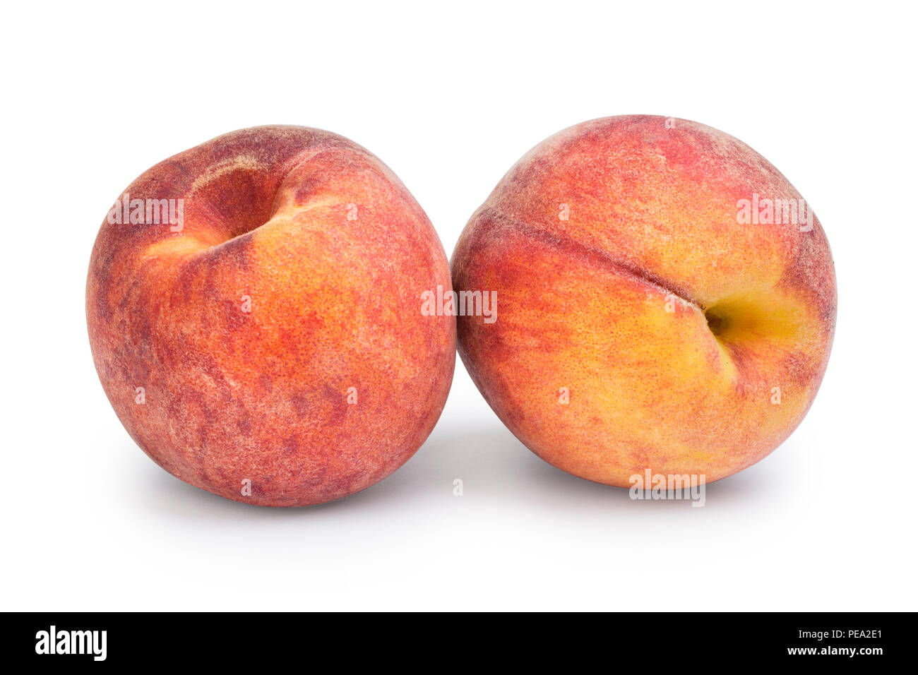 Two ripe fluffy peach isolated on white background Stock Photo - Alamy