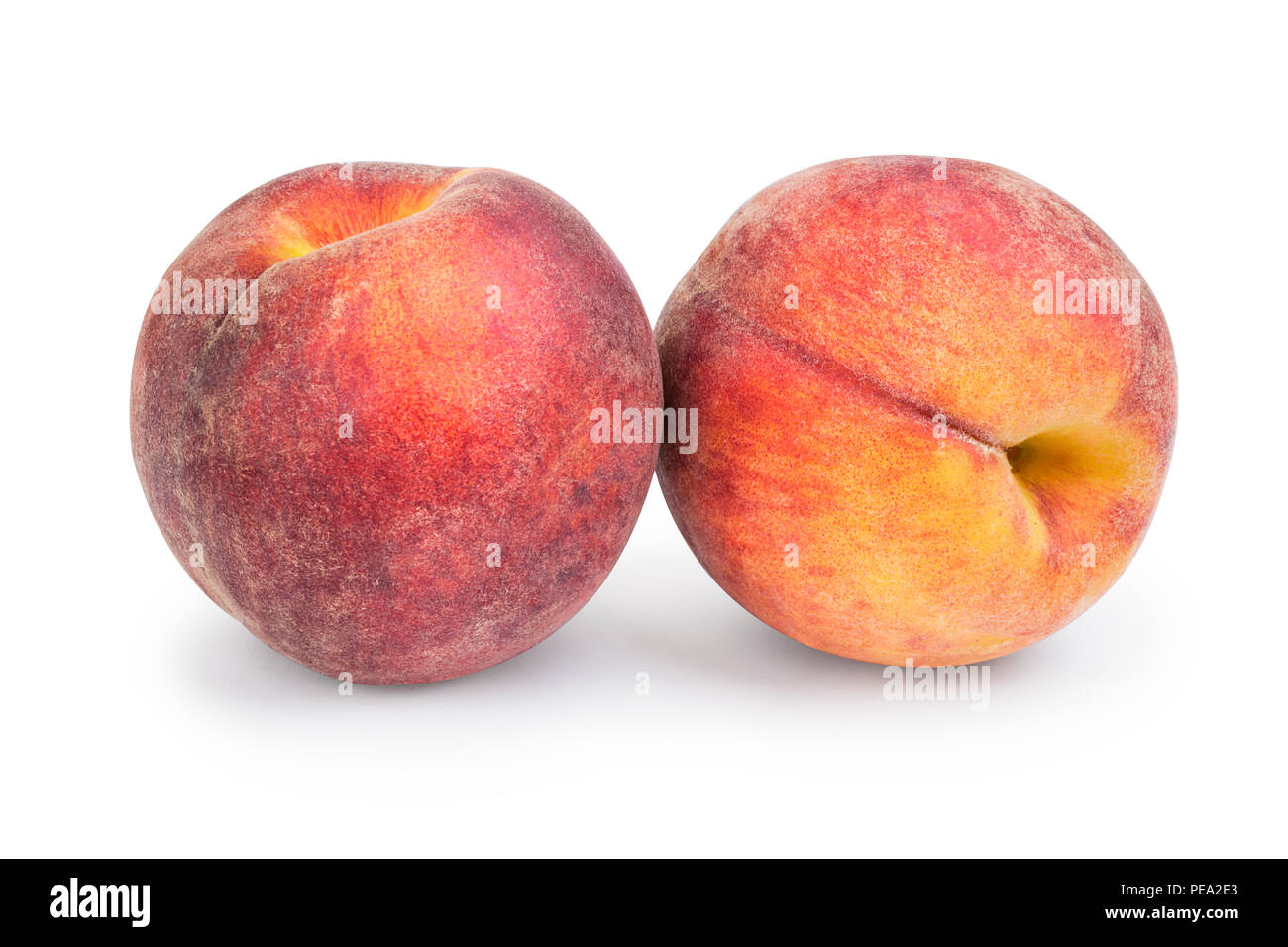 Two ripe fluffy peach isolated on white background Stock Photo - Alamy