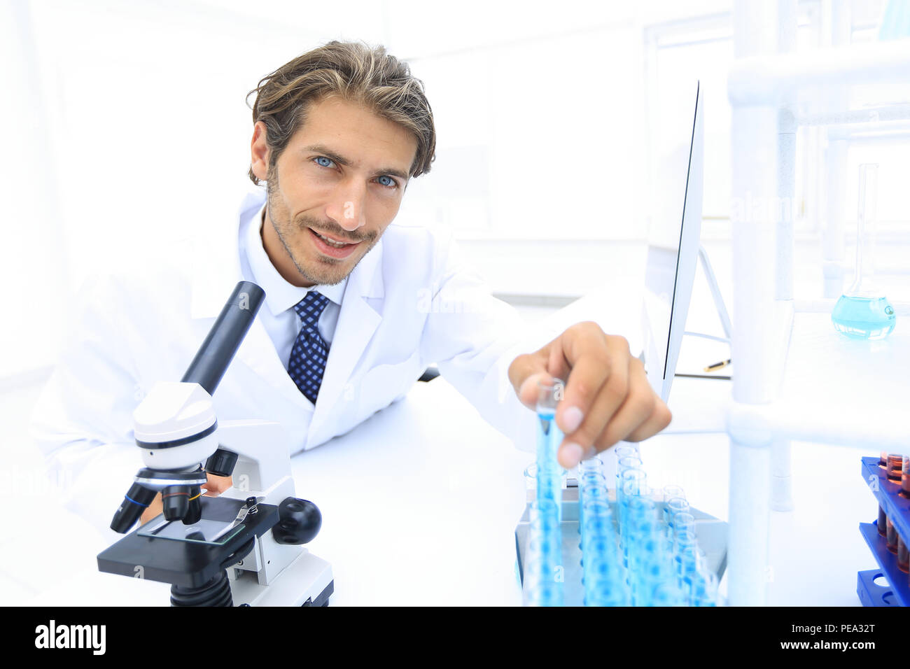 laboratory scientist working in a laboratory with a microscope Stock ...