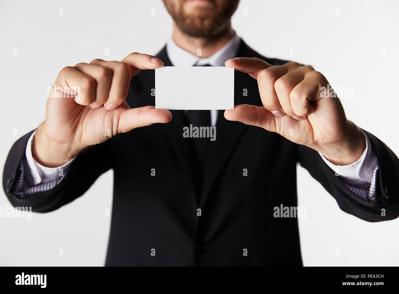 partial view of businessman presenting blank business card isolated on ...