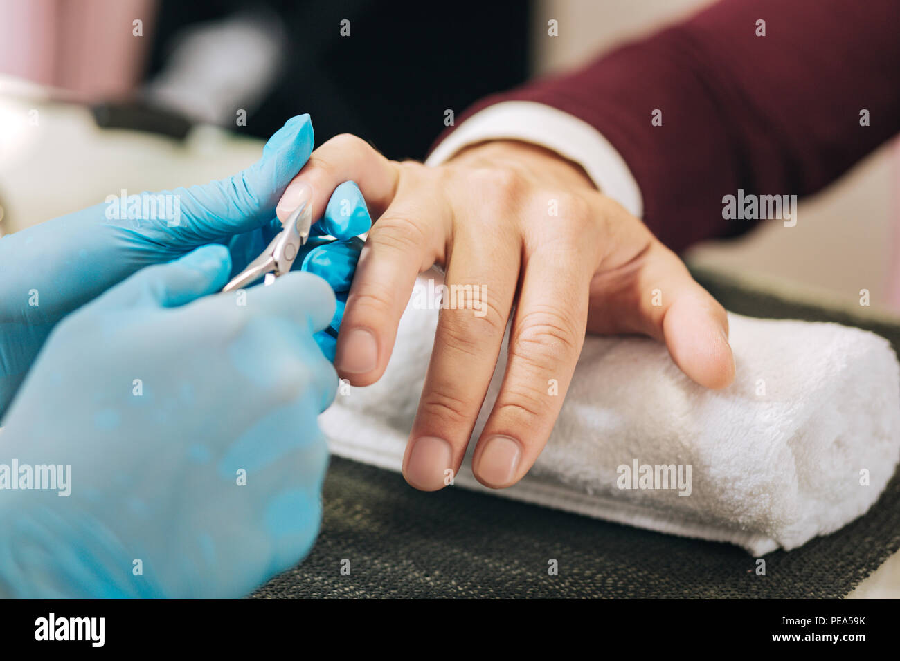 Female hands clipping nails clouse up shot Stock Photo - Alamy
