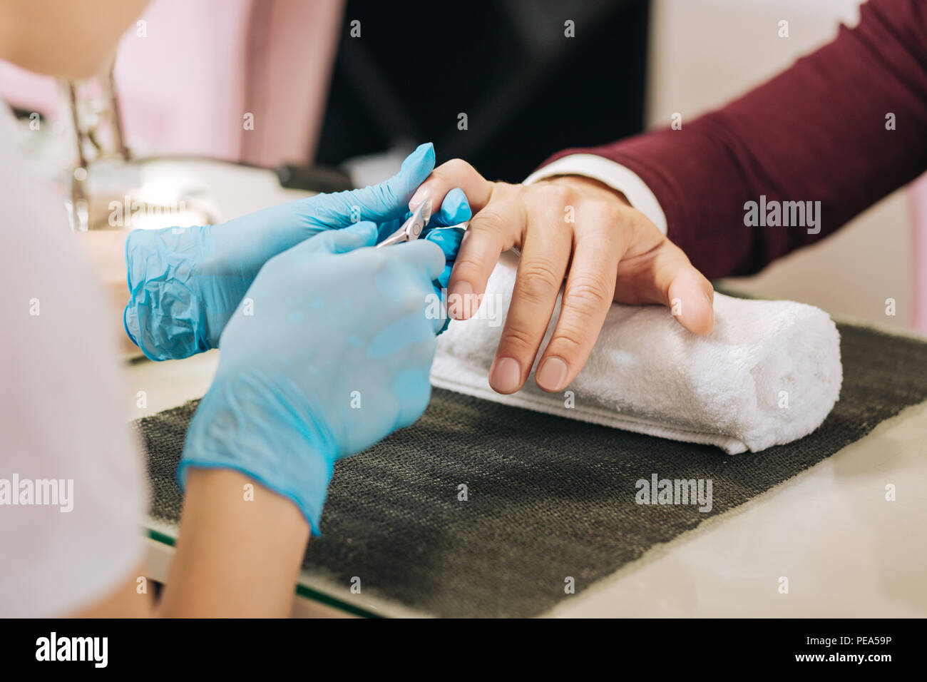 Female hands clipping nails clouse up shot Stock Photo - Alamy