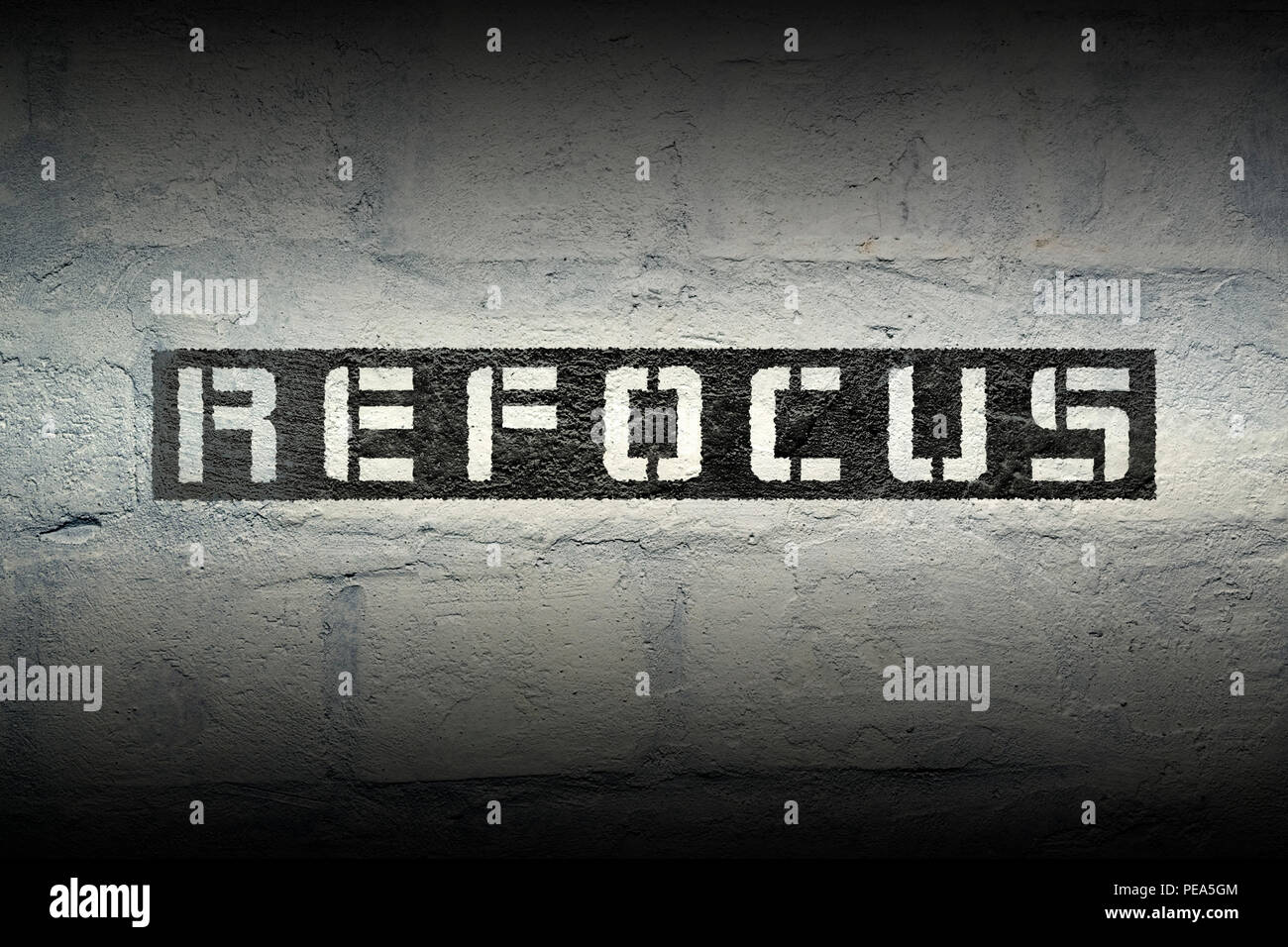 refocus stencil print on the grunge white brick wall Stock Photo - Alamy
