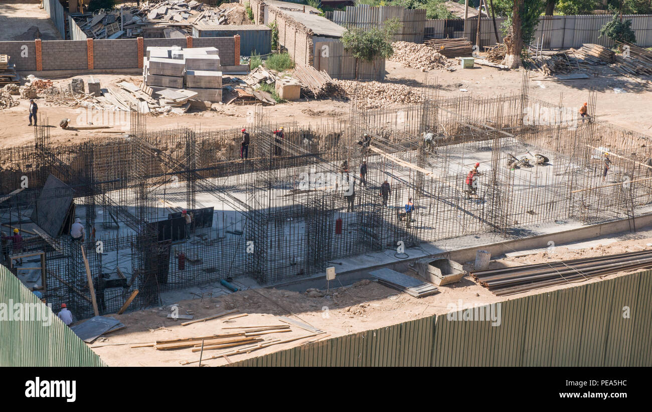 worker and builder on the construction site, top view. the finished ...