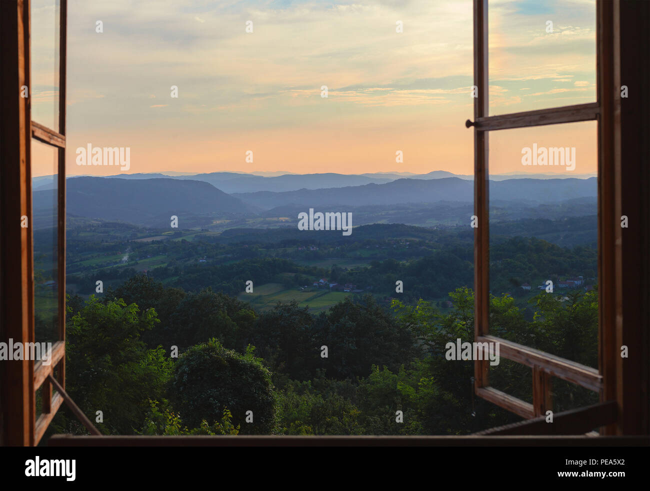 Viewing through old window on village in Serbia, summer season at ...