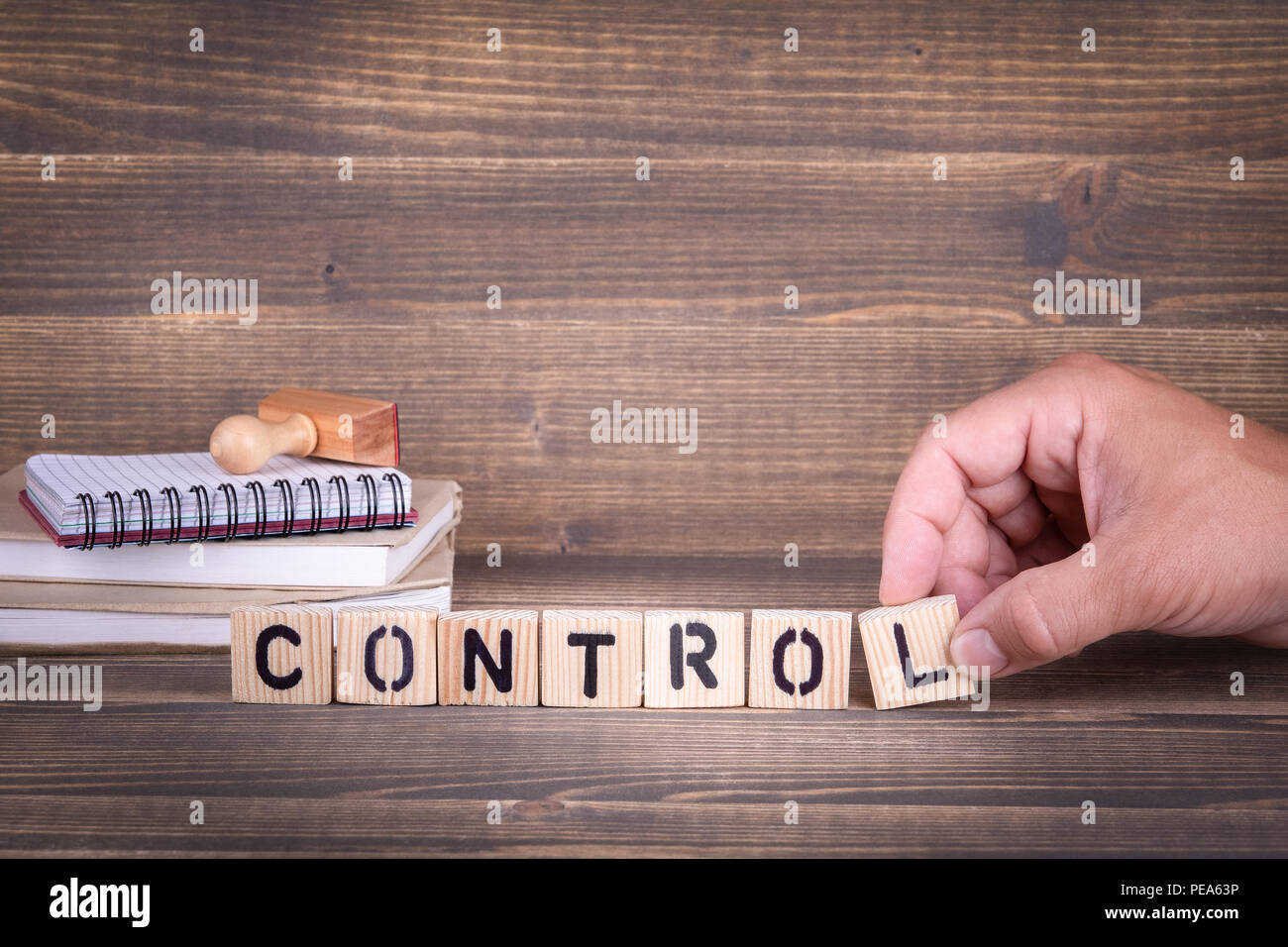control. Wooden letters on the office desk Stock Photo - Alamy