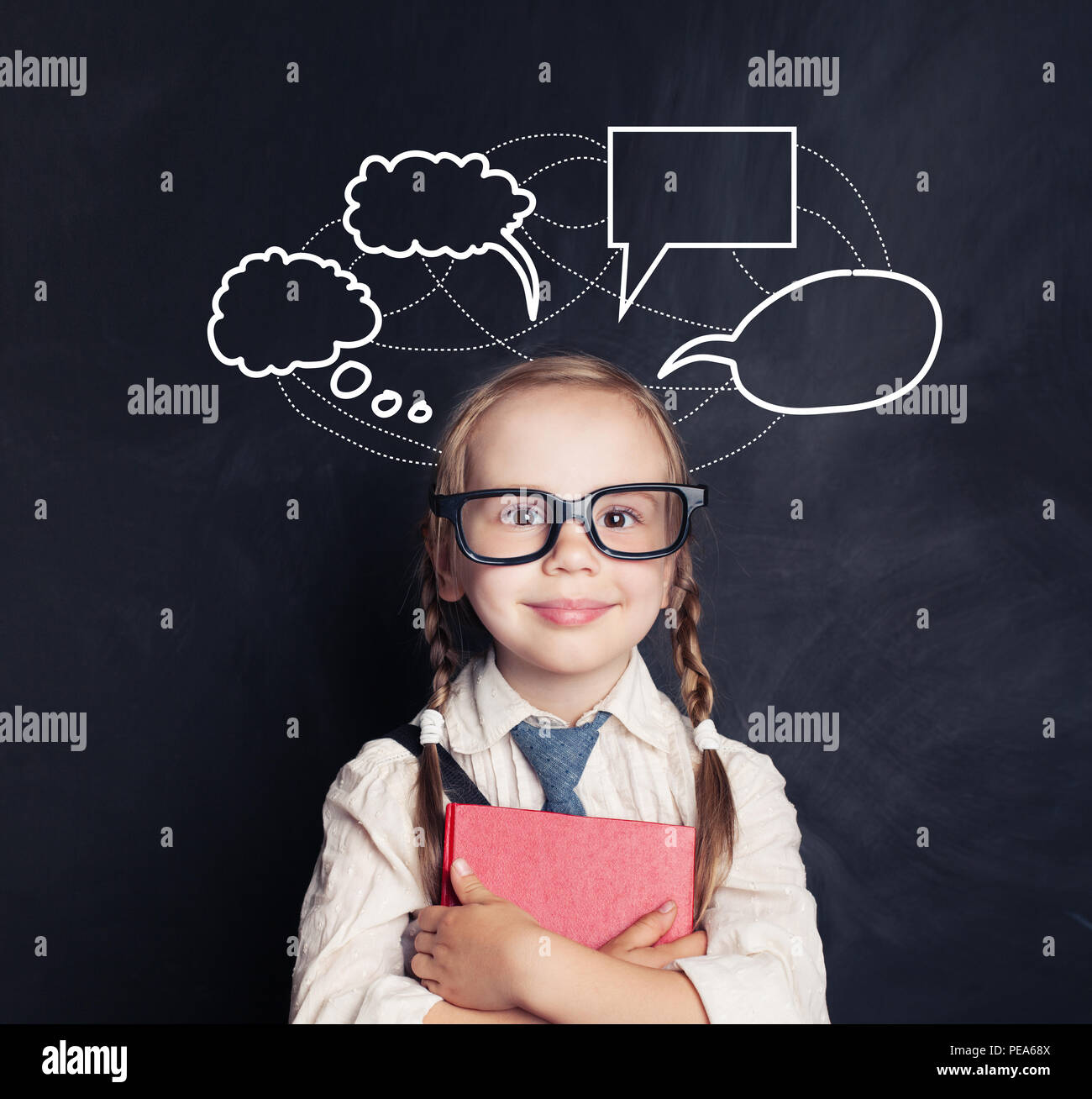 Smiling little girl with book and speech clouds chalk drawing on ...
