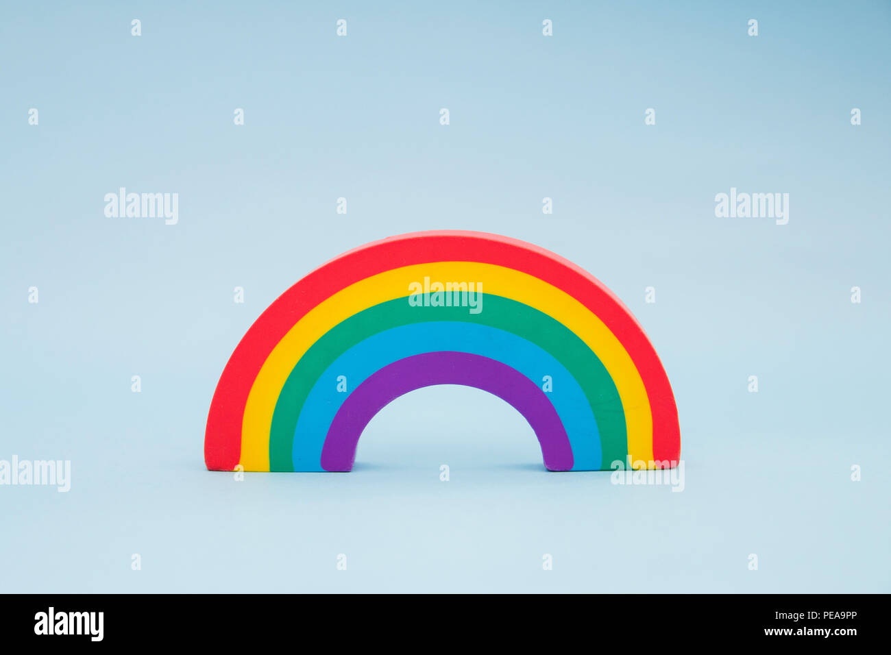 rainbow on blue background Stock Photo - Alamy