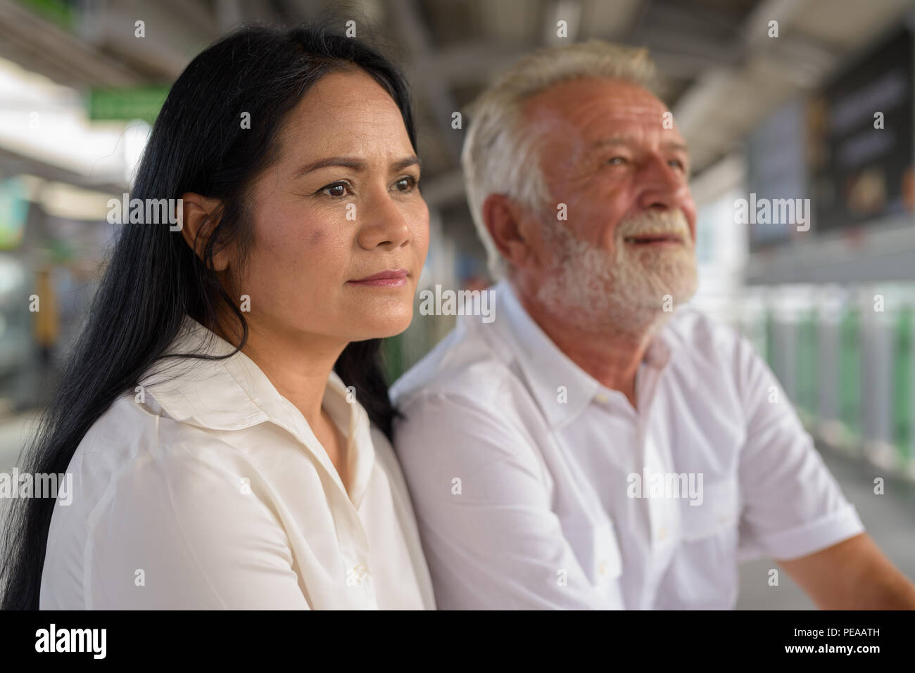 Mature multi-ethnic couple happy and in love while exploring the Stock ...