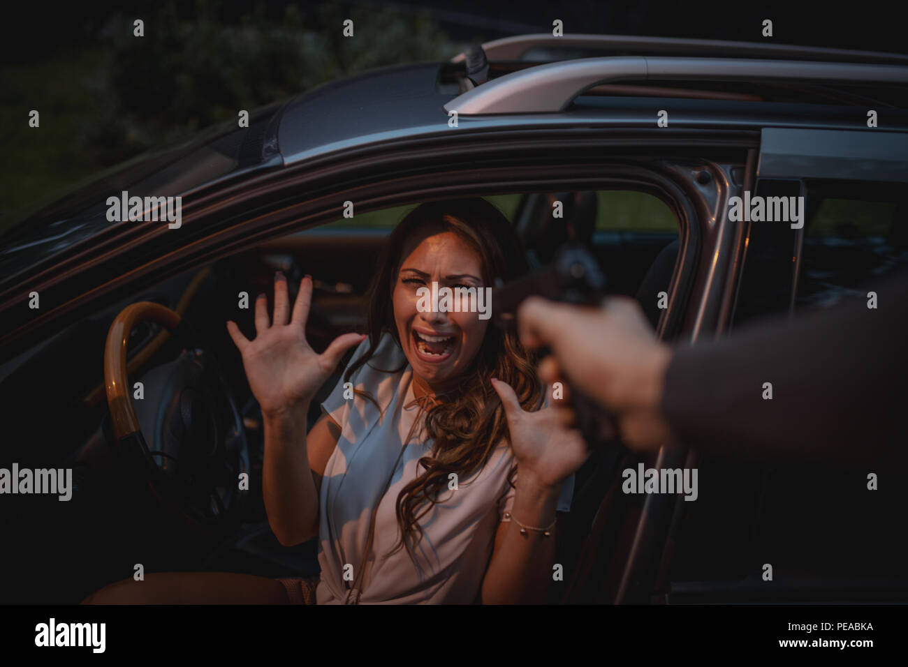 Bandit robbery woman with gun feeling shock and scared in car Stock ...