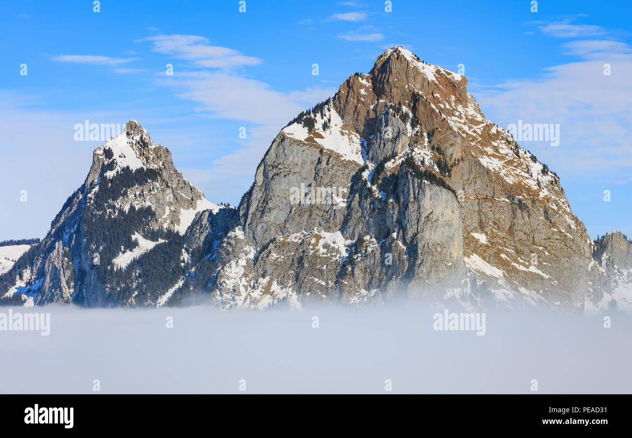 Summits of the Kleiner Mythen and Grosser Mythen mountains rising from ...