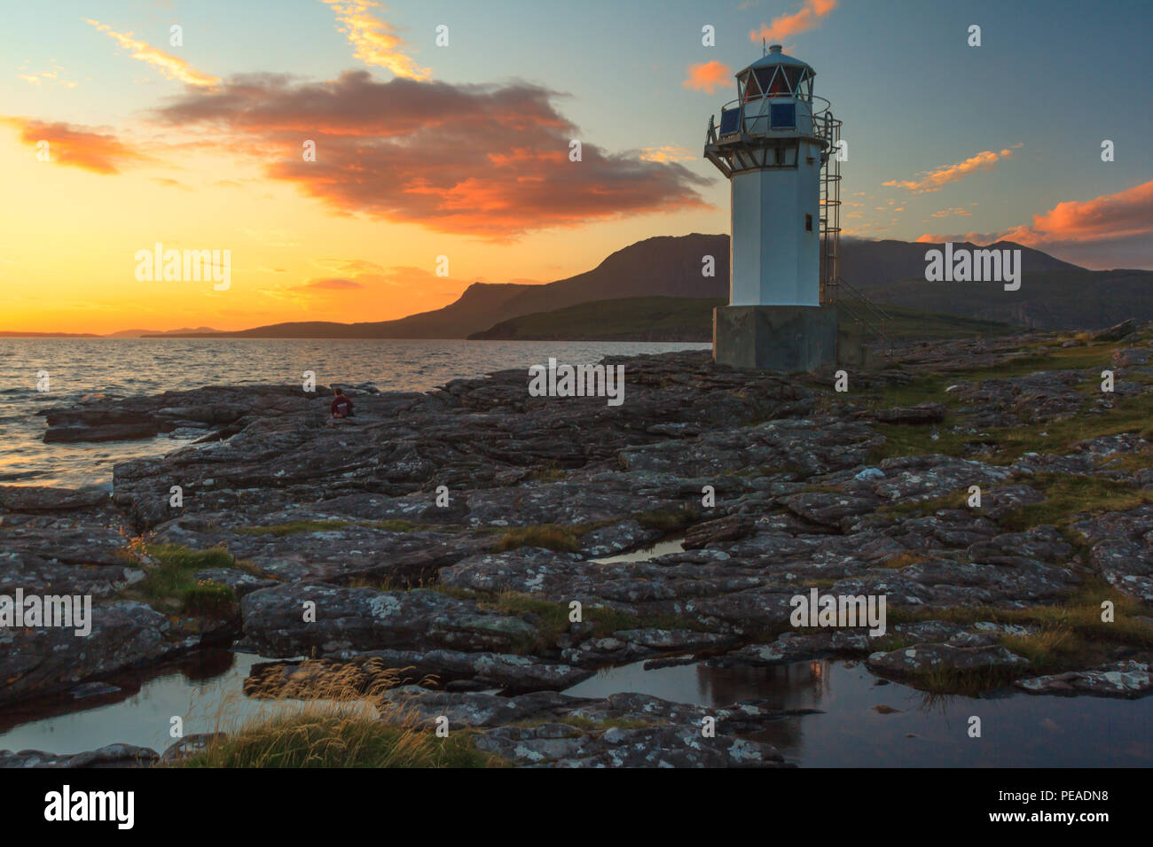 Rhue Lighthouse, Ullapool, Scotland, at sunset in summer Stock Photo ...