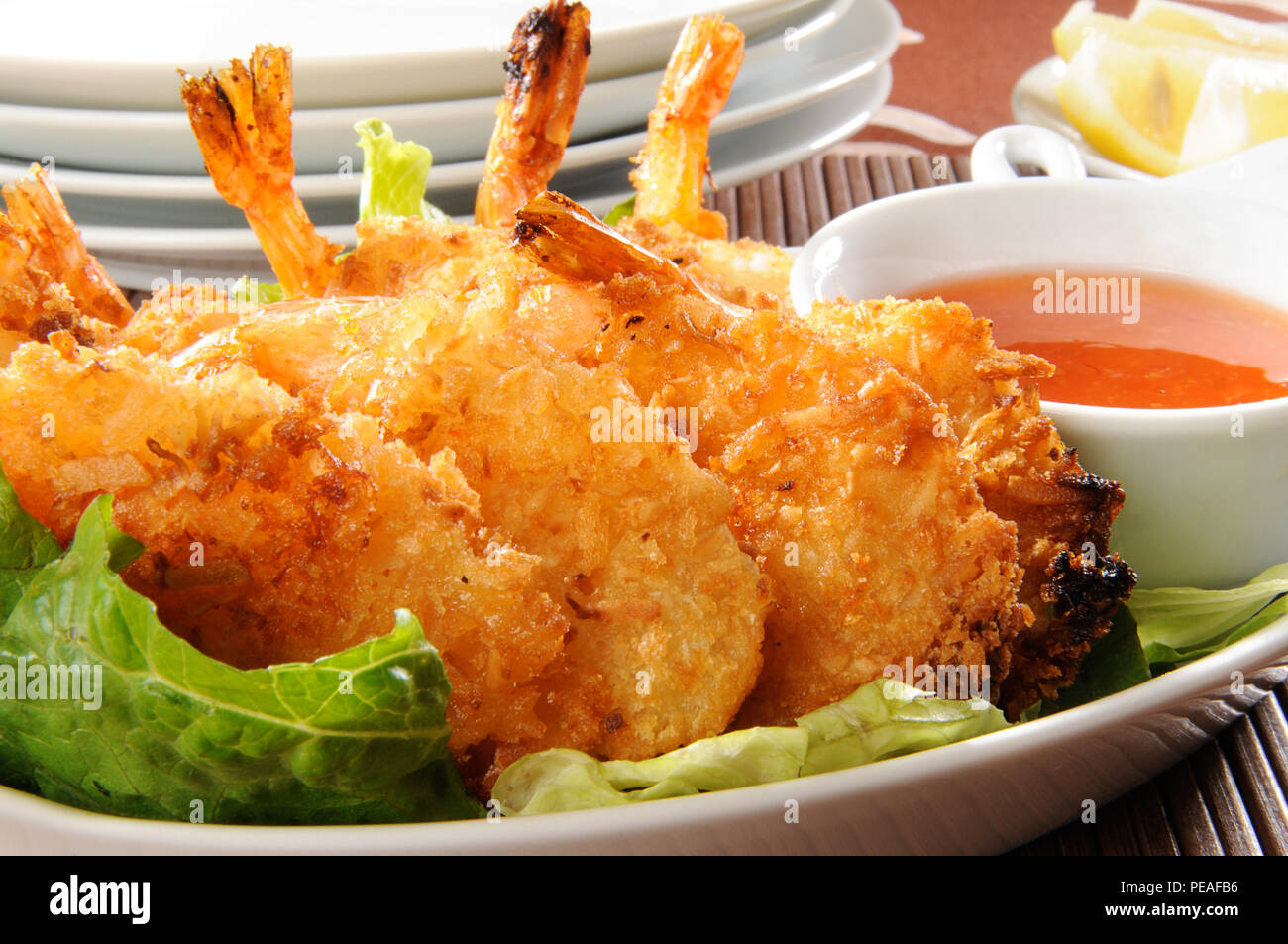 A plate of coconut shrimp with sauce Stock Photo - Alamy