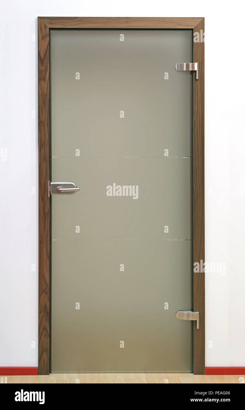 Closed glass door inside modern interior Stock Photo - Alamy