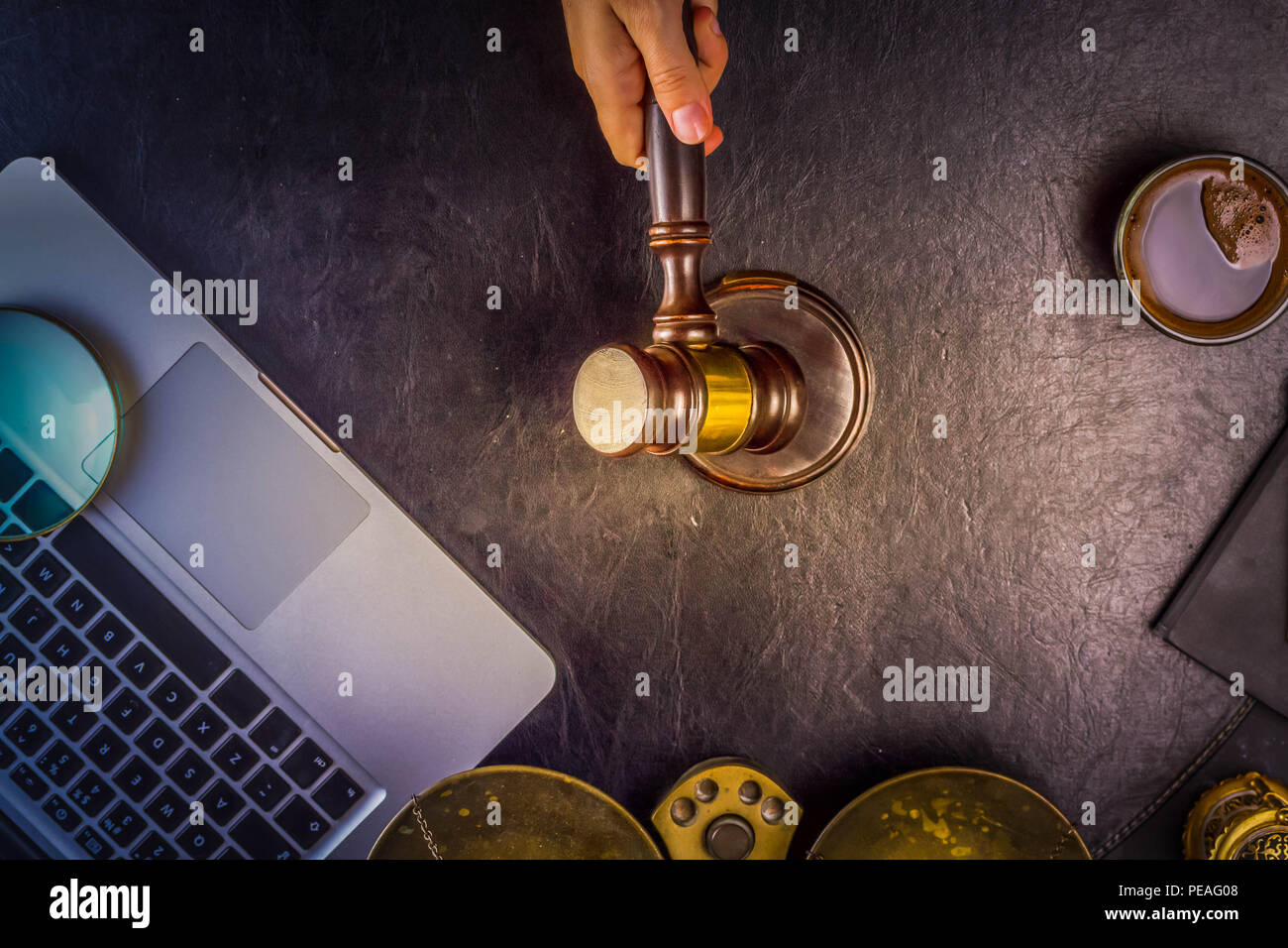 Hand holding law gavel Stock Photo - Alamy