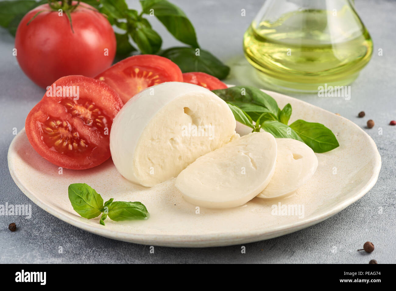 Mozzarella Buffalo with basil leaves and tomatoes Stock Photo - Alamy