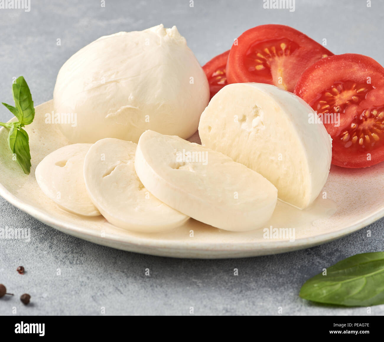 Mozzarella Buffalo with basil leaves and tomatoes Stock Photo - Alamy