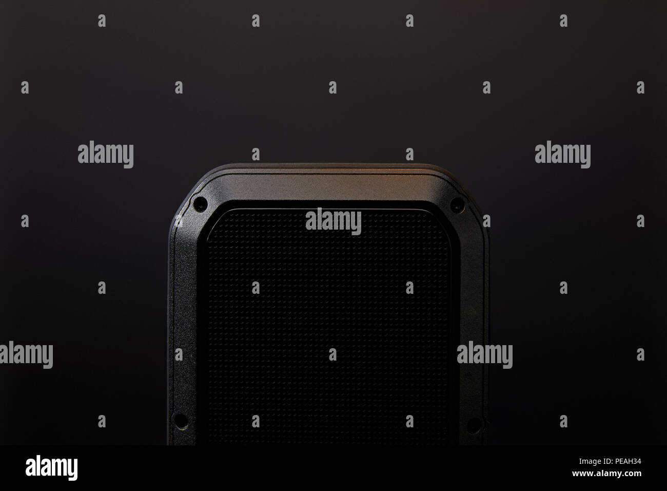 close up view of black audio speaker on black wall backdrop Stock Photo ...