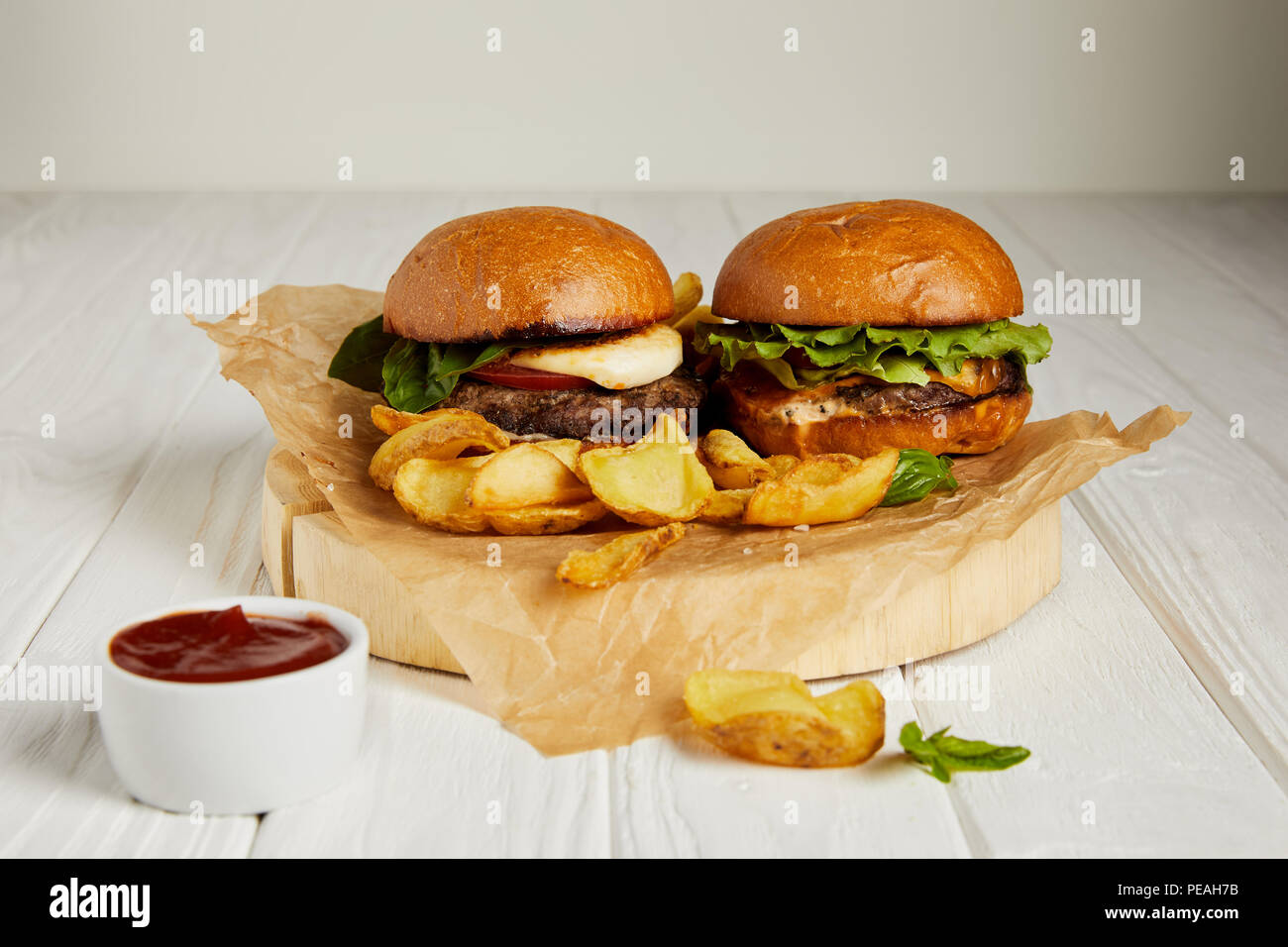 Junk food diner with hamburgers and french fries served with sauce on ...