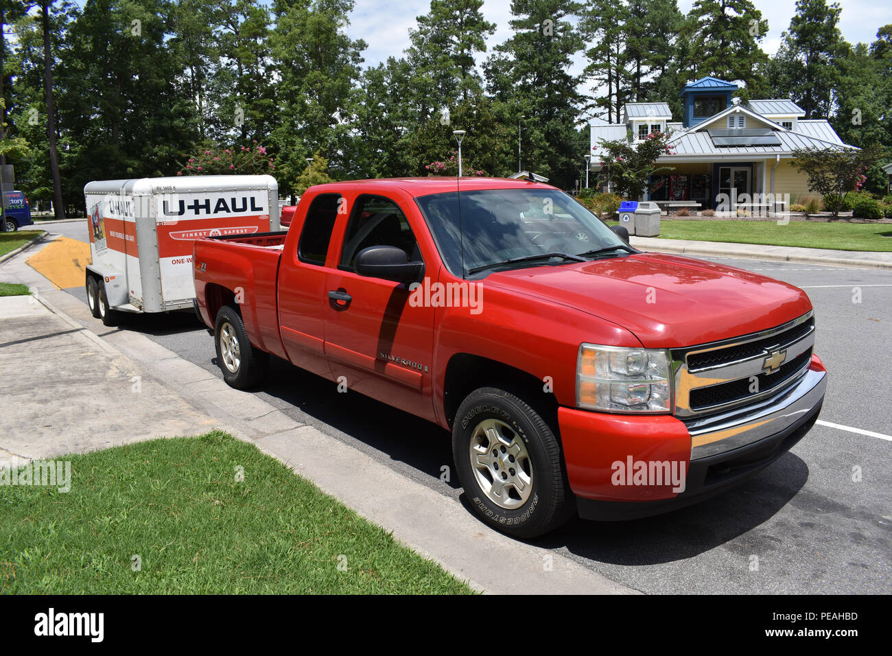 A 2007 Chevrolet Truck towing a tandem axle U-Haul Trailer Stock Photo ...