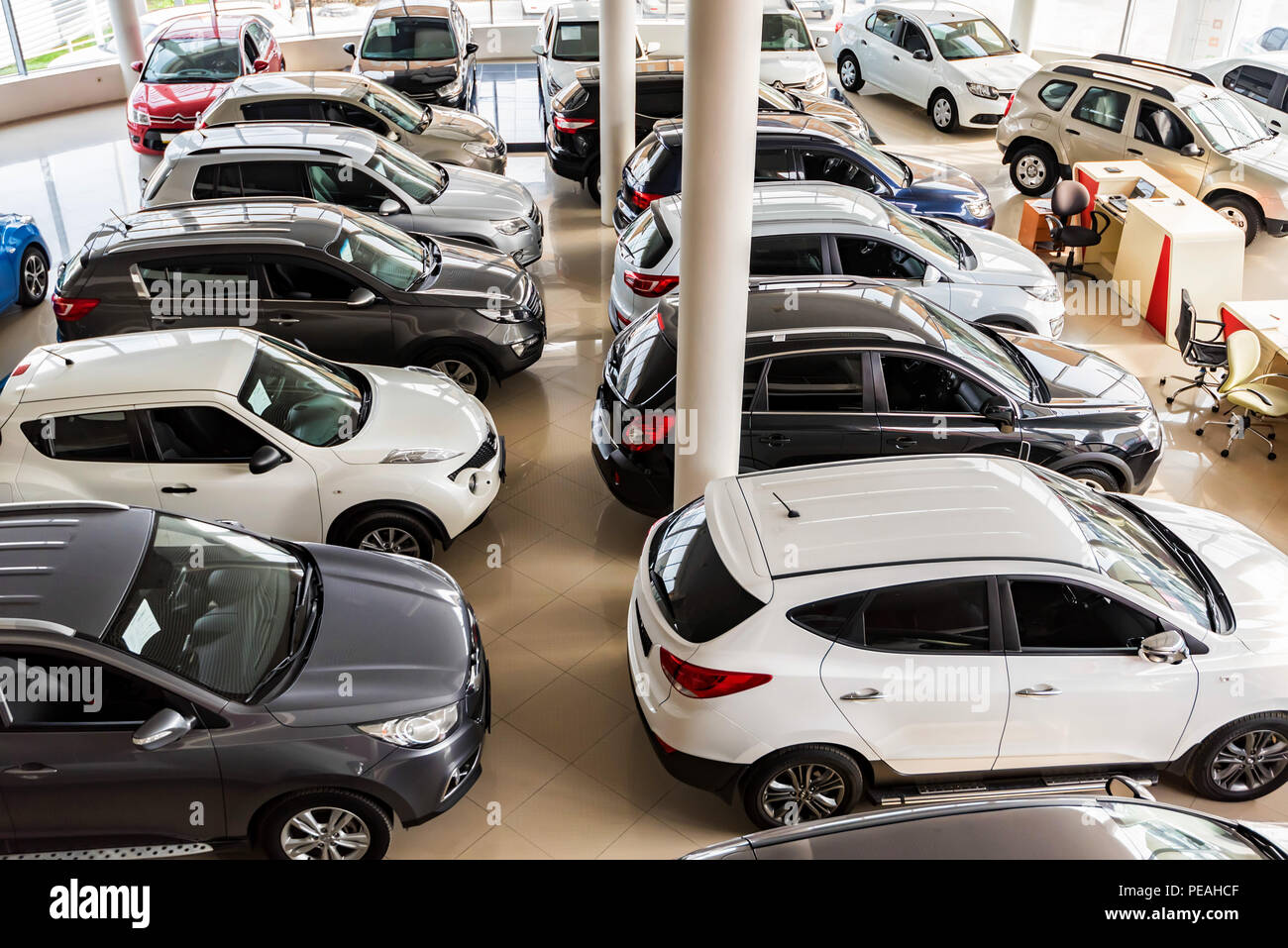 Top view new cars at dealer showroom Stock Photo - Alamy
