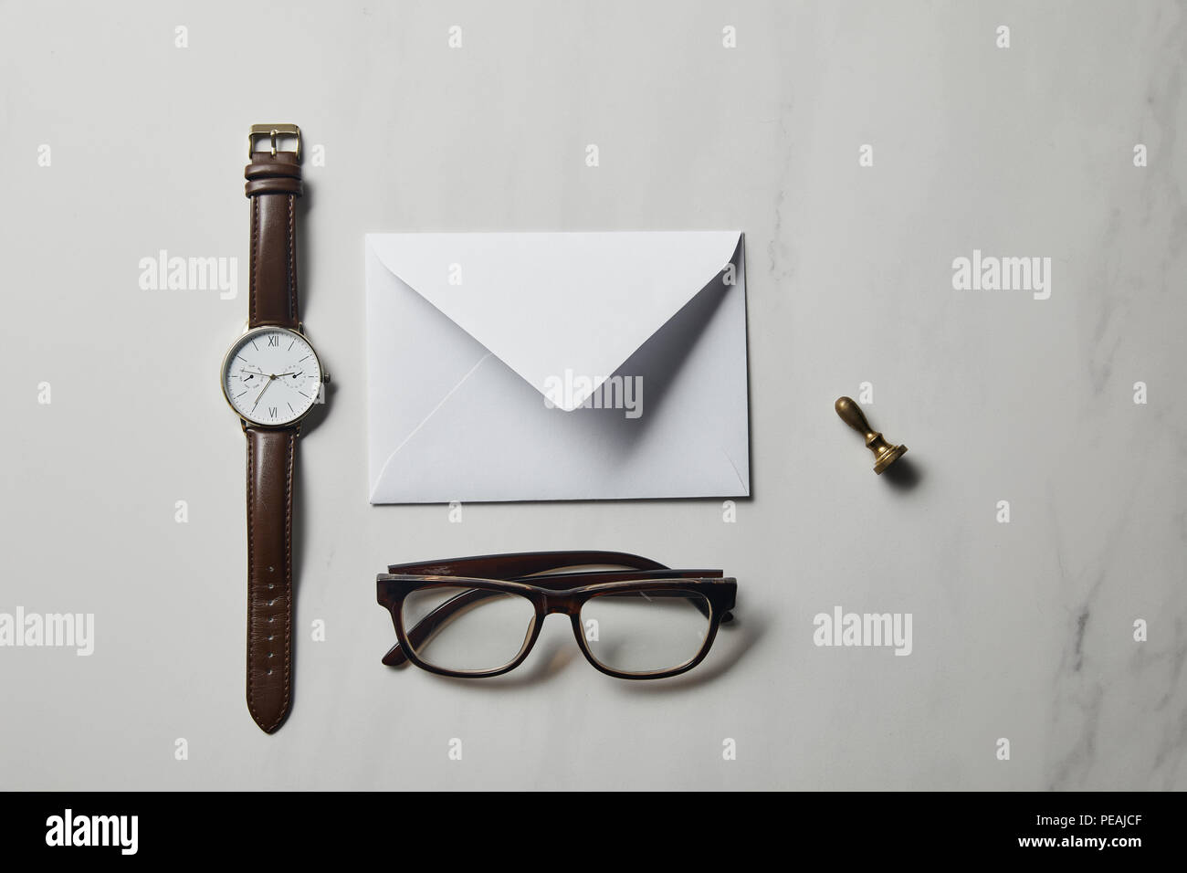 Letter template with glasses and watch on white marble background Stock ...