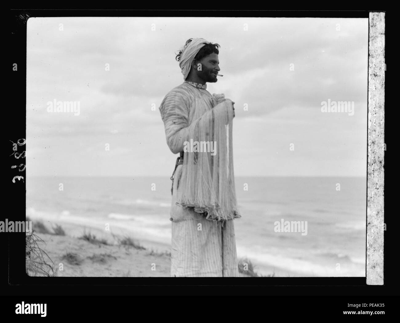 Arab fisherman on the Askalon coast. Holding his throw-net Stock Photo ...